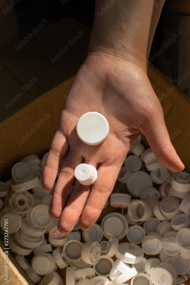 Open hand with plastic caps eco friendly man sorting and putting ...