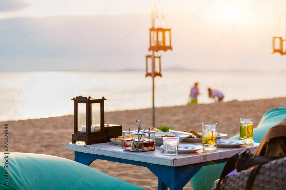 Food and beverage on the table at beach bar for dinning party on the ...
