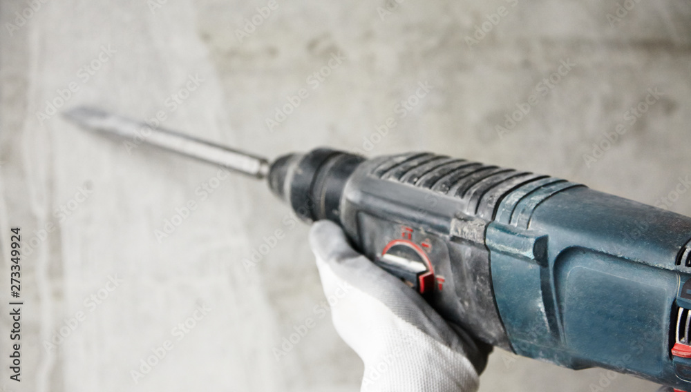 Abstraction photo of noisy repair. electric tool in the hands of a ...