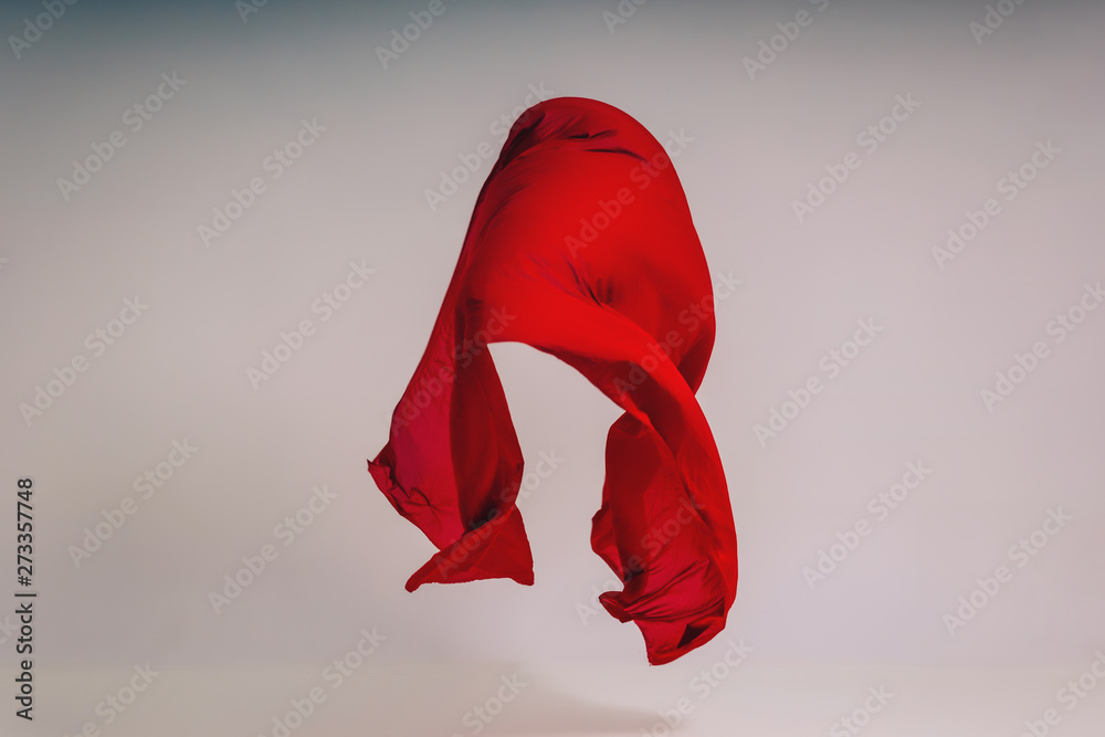 Red fabric on a white background. Levitation of red fabric in the photo ...