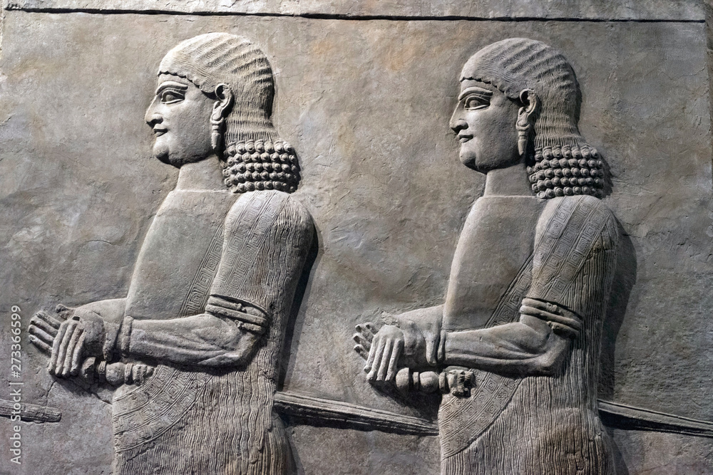 Ancient Sumerian stone carving on wall, bas relief on wall. Stock Photo ...