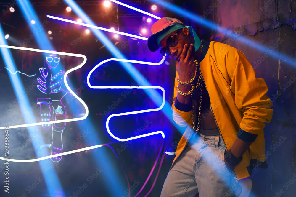 Black rapper in underpass neon light on background Stock Photo | Adobe ...