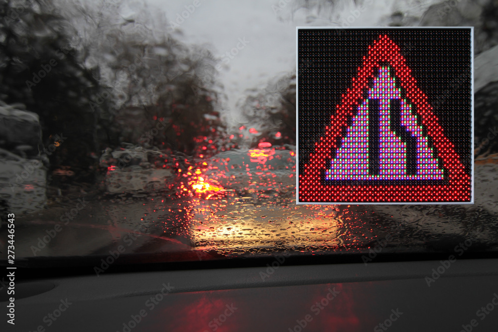 Colorful traffic warning and guidance signs made with LED lights. One ...