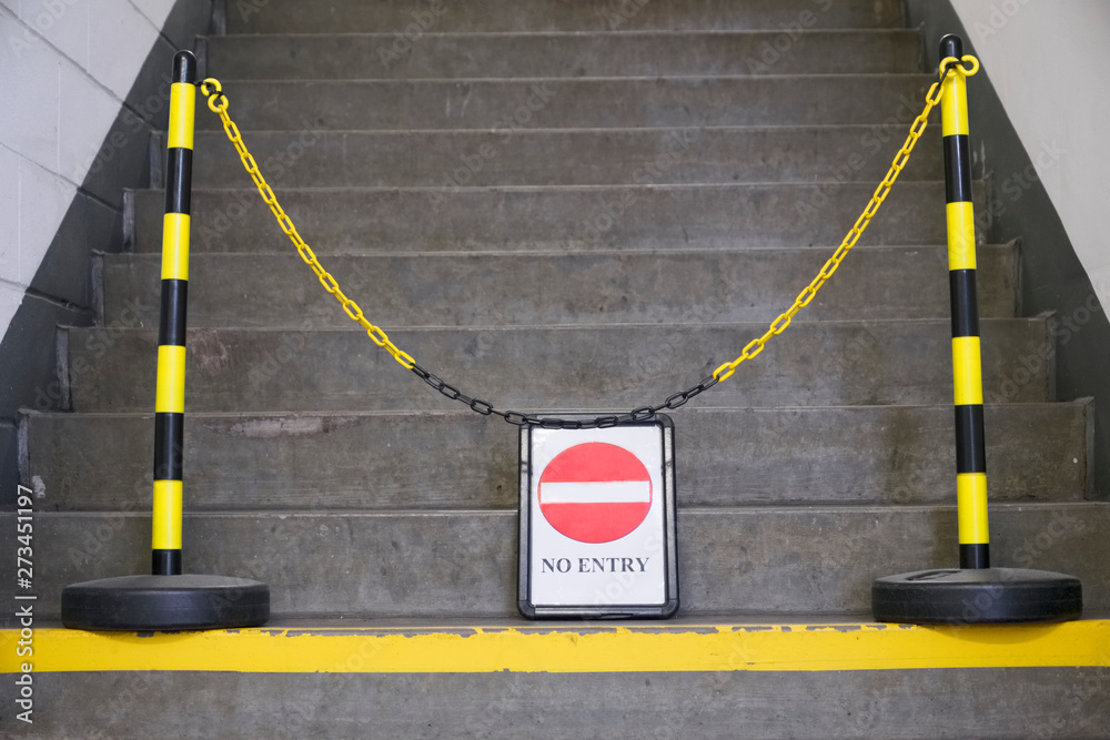 No entry sign and yellow chain in front of stair steps Stock Photo ...