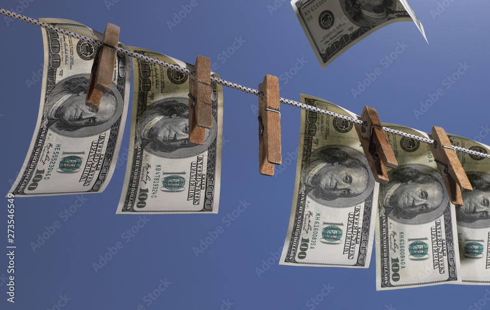 Foto de Money Hanging On a Clothesline With Old Wooden Clothespin. The ...