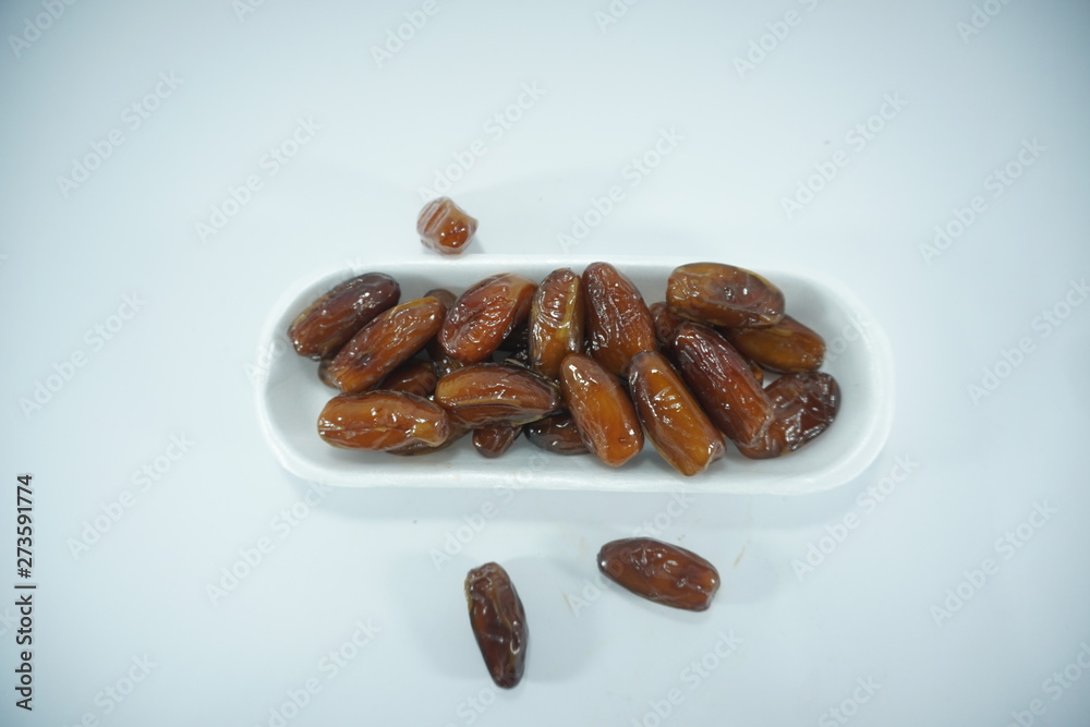 stack of dates in a white container top view isolated on white ...