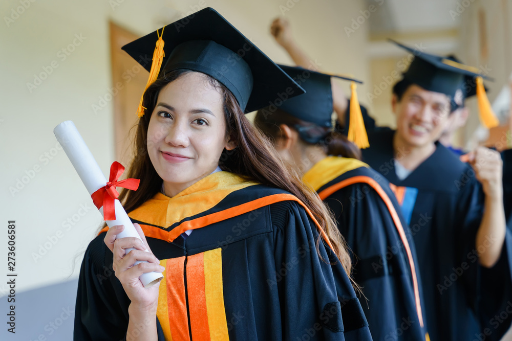 Female university graduates celebrate happily after completed and ...