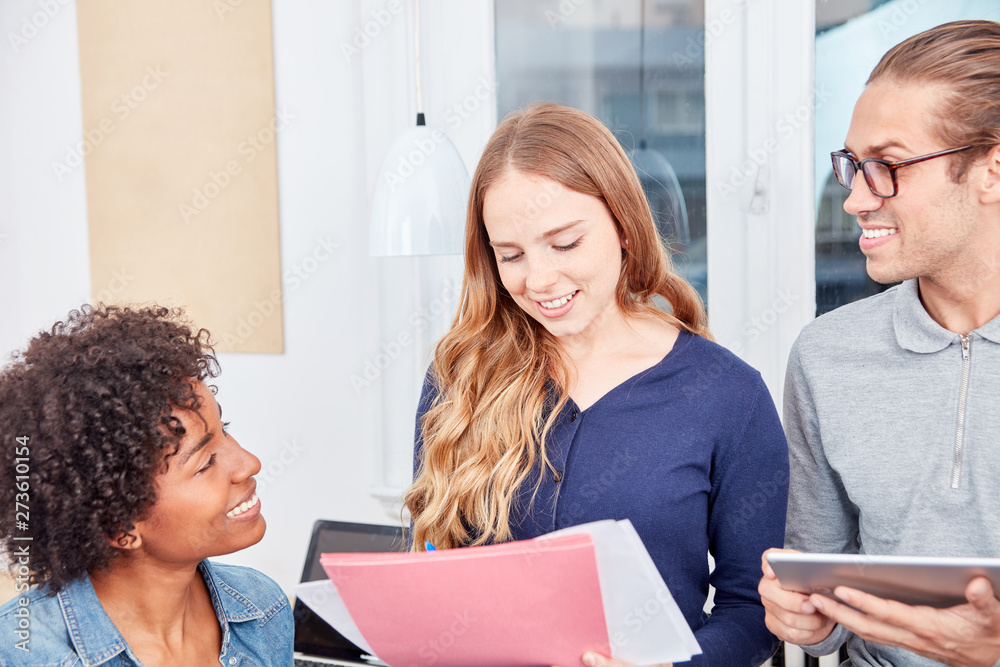 Three students learn together as a team Stock Photo | Adobe Stock