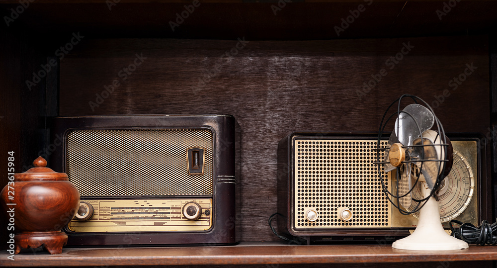 Old fashioned items on wooden shelf. Colorful of ancient collection in ...