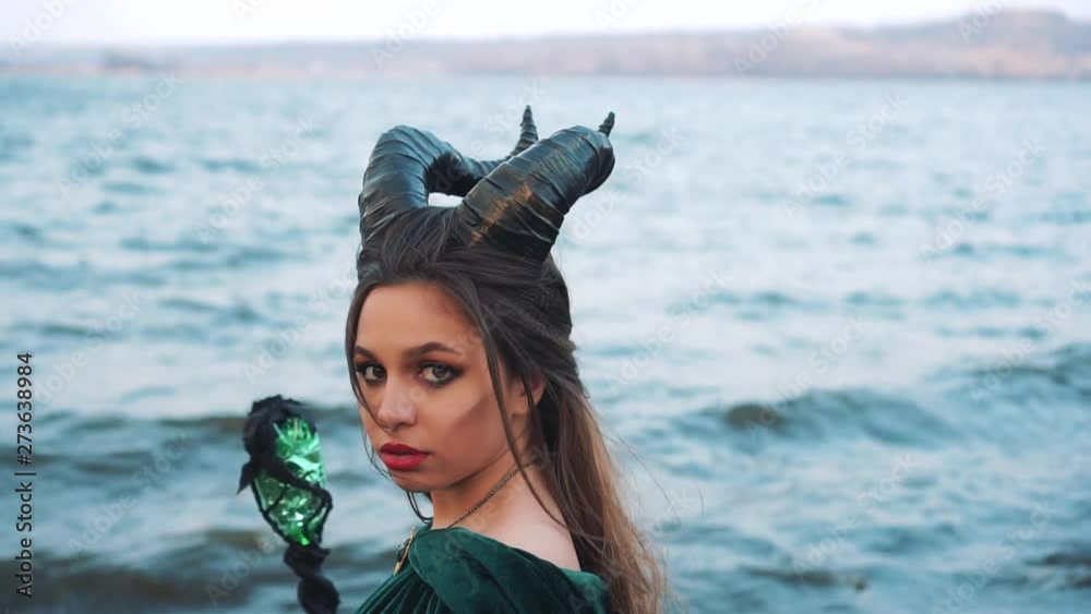 young vampire chase, girl with long hair in emerald dress with magic ...