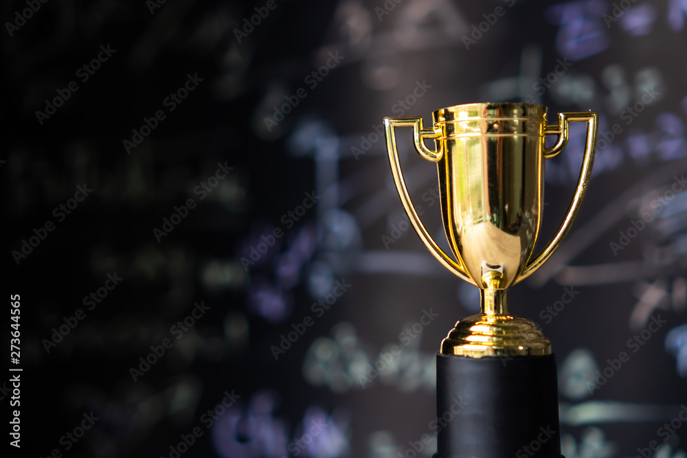Achievement success in education awards concept: Golden trophy cup ...