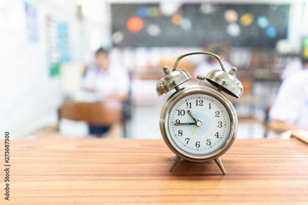 Test Examination in Education concept,Alarm clock on wooden table ...
