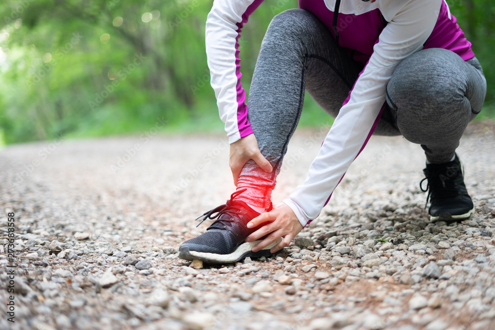 sport runner woman cramps in leg and feel pain, athletic young Asian ...