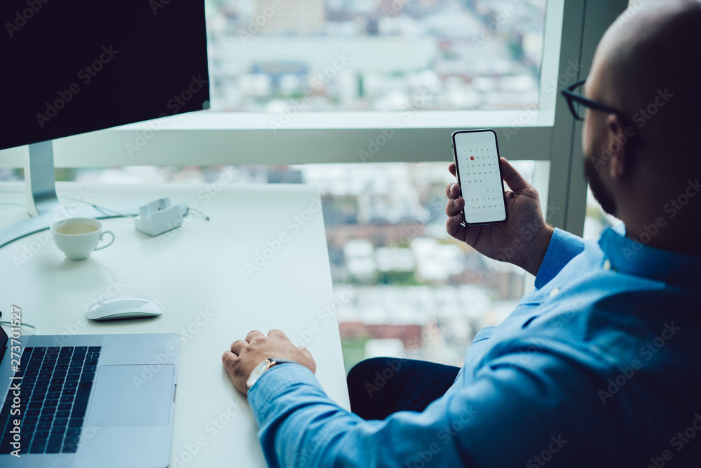 Businessman checking calendar on smartphone Stock Photo | Adobe Stock