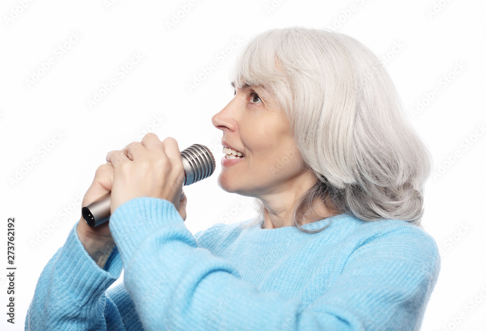 lifestyle, emotion and people concept: Happy old senior woman singing ...