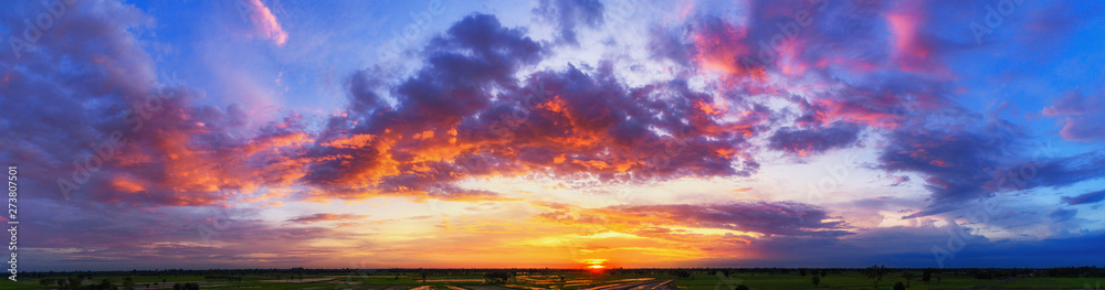 Wide panorama of sunset sky with clouds and sunlight over farm Stock ...