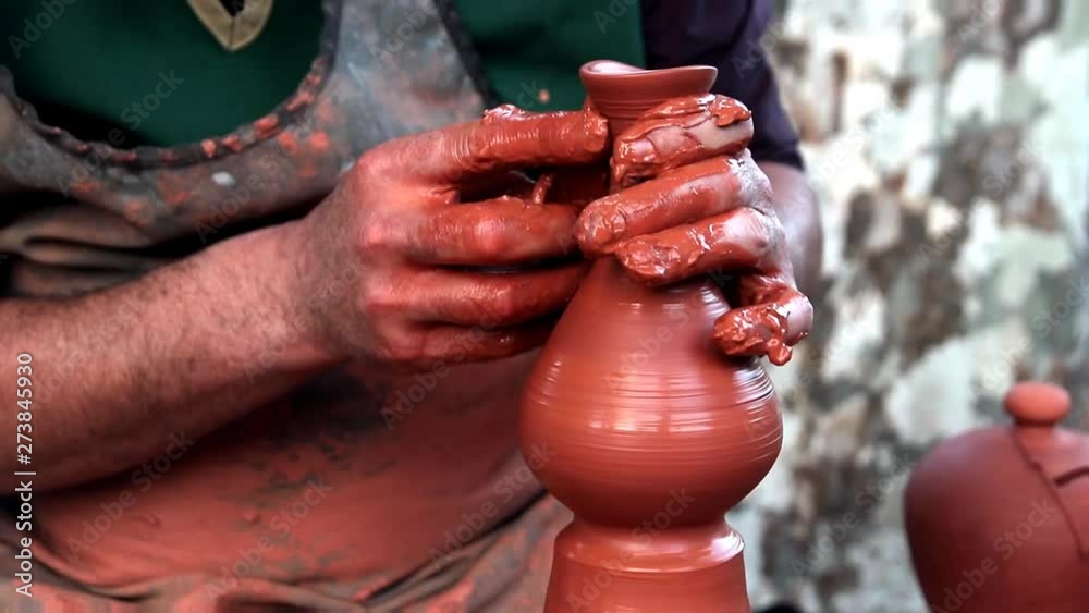 Medieval Potter using potters wheel and hands crafting earthenworks ...