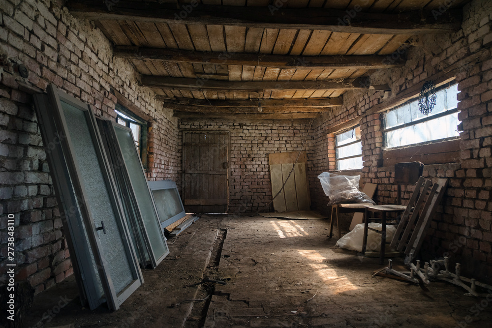 Old barn interior in the village. Vintage shed built of wood and brick ...