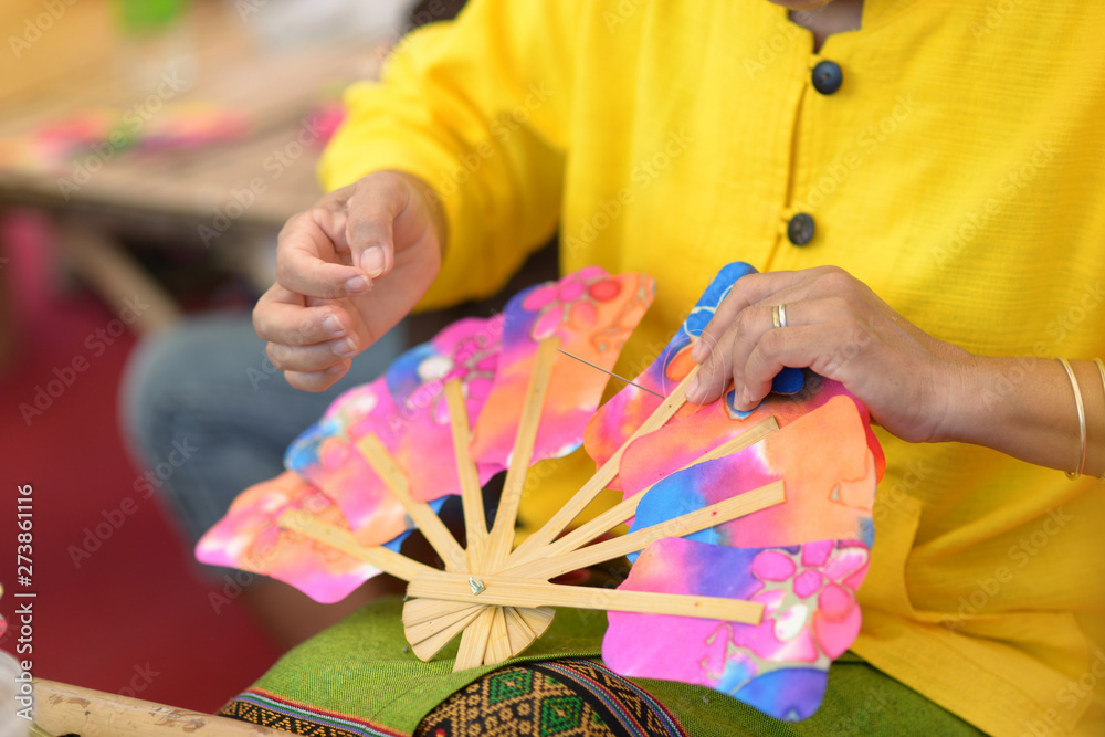 Woman sewing folding paper fan.Making process of folding paper fan ...