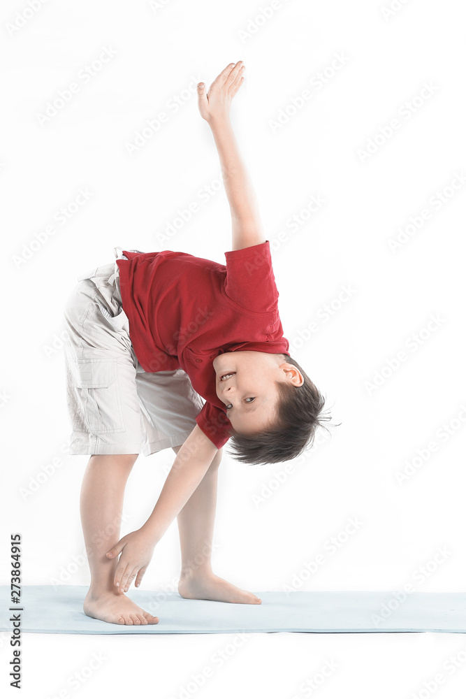 little boy performs an exercise to stretch the muscles.isolated on ...