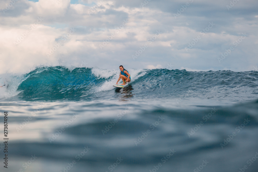 Surf girl on surfboard. Woman in ocean during surfing. Surfer and wave ...