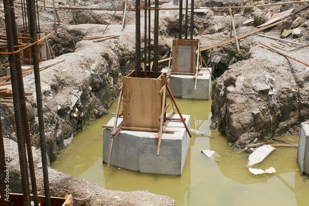Pile cap and column stump under construction at the construction site ...