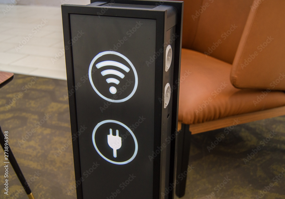 Stand tower for charging mobile phones in a shopping center, the sign ...