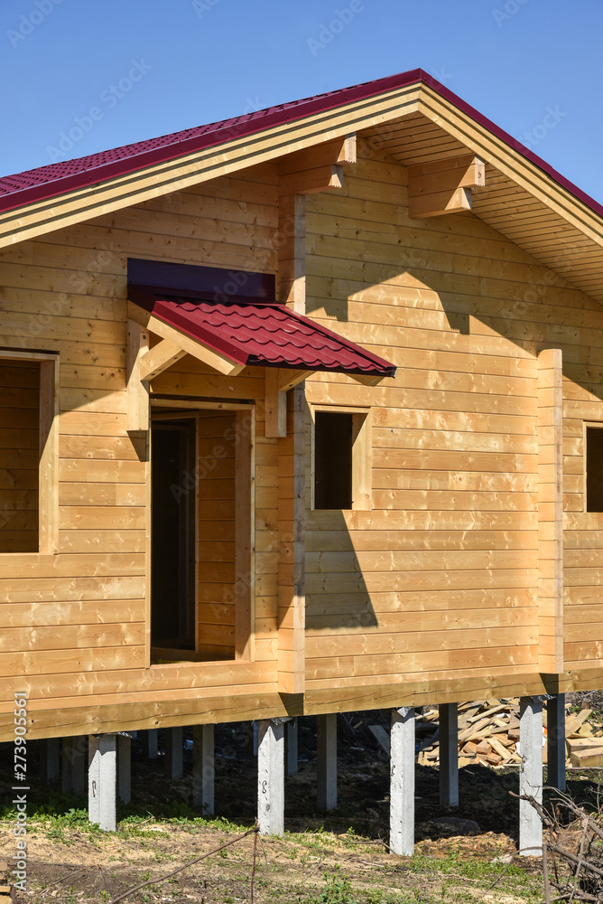 Ecological material.Country private house.One-storey timber house with ...