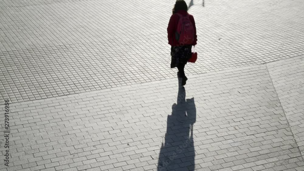 Black and white shadows moving from the metro. People walking ...