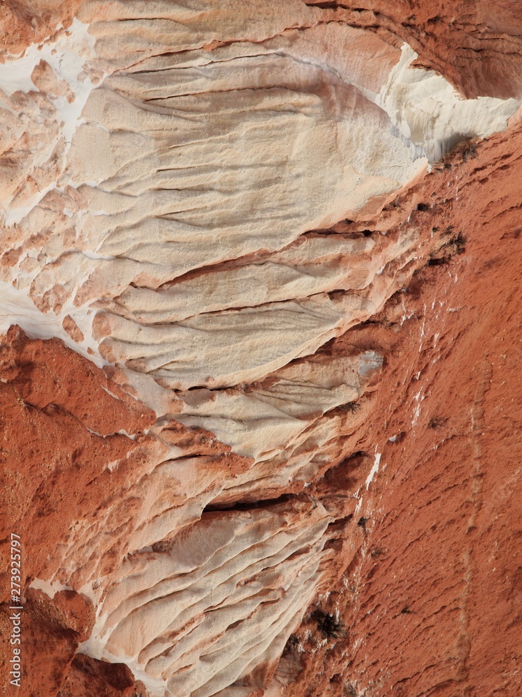 Red high cliffs at Praia da Falesia, a paradise beach in Albufeira in ...