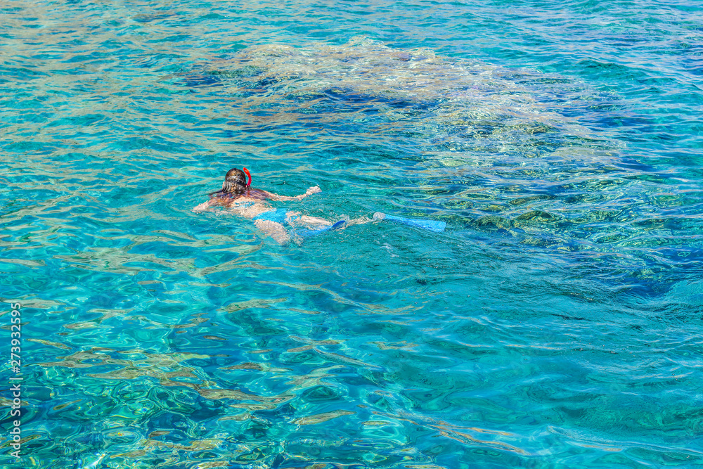 sexy girl swimming and snorkeling in Red sea beautiful aquamarine water exotic natural ...