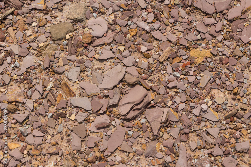 Reddish brown stacked rock and gravel background, flaky stone ...