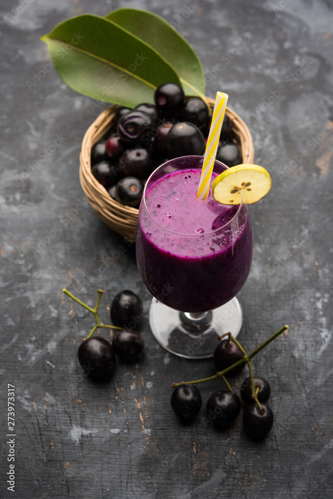 Juice of jamun fruit in a glass also called as java plum, jambolan plum ...