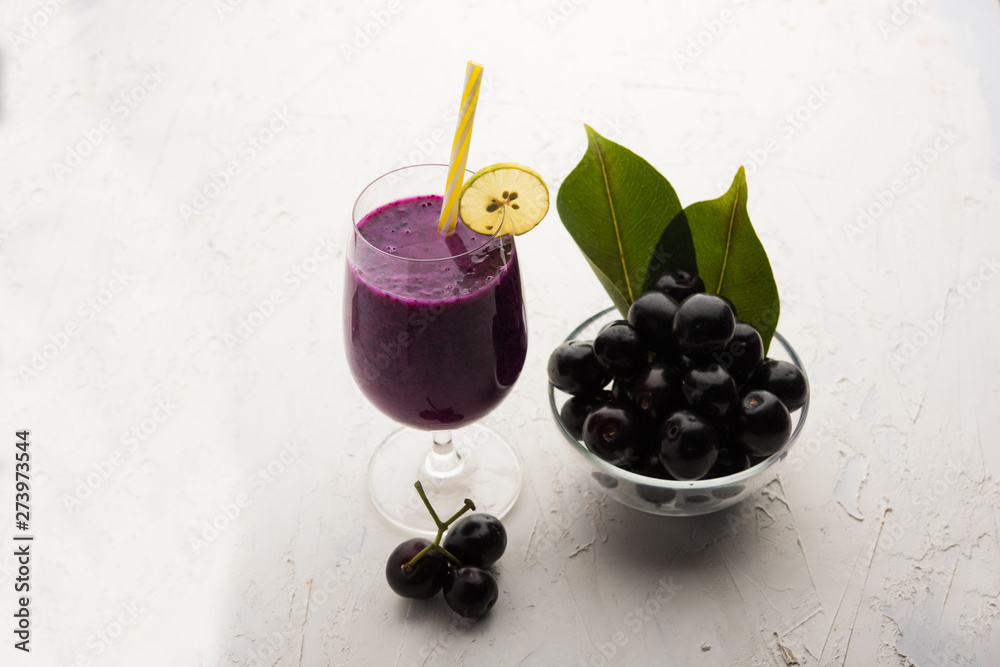Juice of jamun fruit in a glass also called as java plum, jambolan plum ...