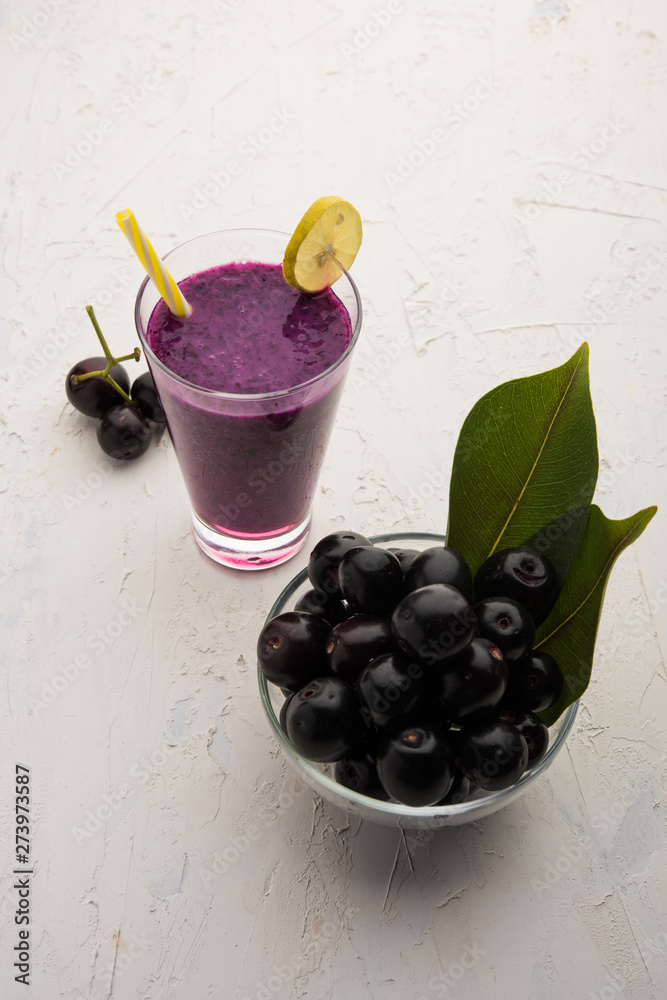 Juice of jamun fruit in a glass also called as java plum, jambolan plum ...