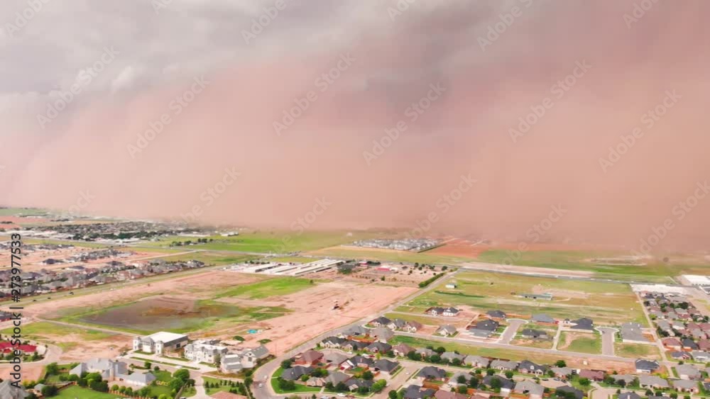 4K Ariel pan footage of a giant dust storm or haboob approaching a ...