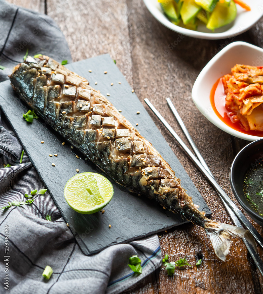 One set of saba grill serve with slide dish, kimchi, rice and seaweed ...