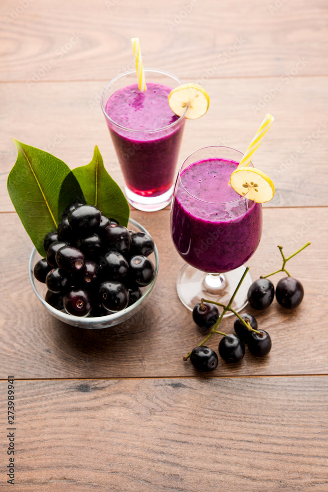 Juice of jamun fruit in a glass also called as java plum, jambolan plum ...