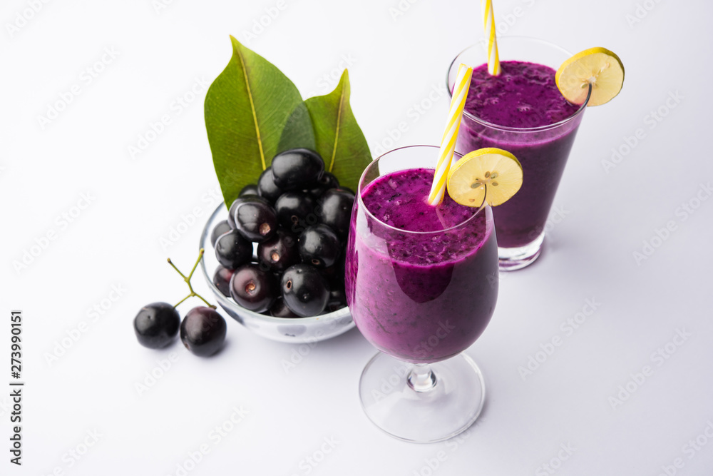 Juice of jamun fruit in a glass also called as java plum, jambolan plum ...