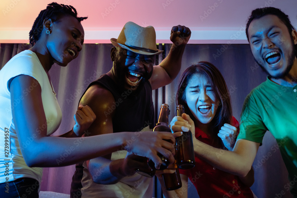 group of people holding beer and wine, party mood of leisure and ...