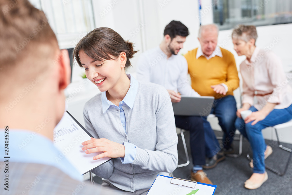 Woman as trainee in business workshop Stock Photo | Adobe Stock