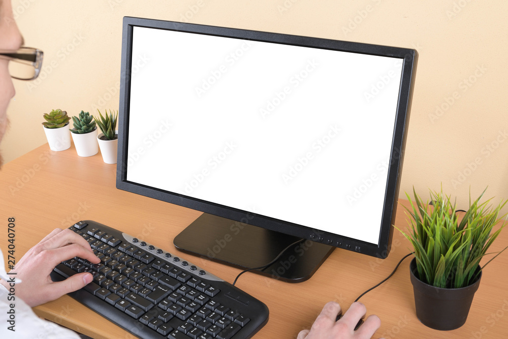 Businessman looking at computer screen using a desktop computer with a ...