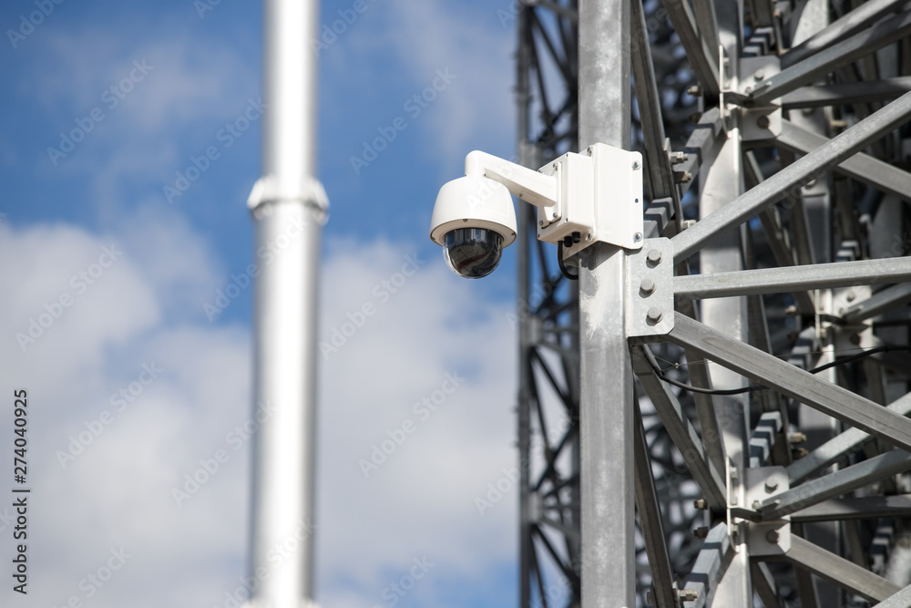 View of a contemporary surveillance video cam attached to a metal ...