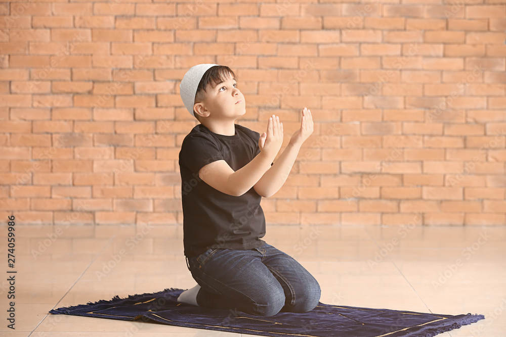 Little Muslim boy praying indoors Stock Photo | Adobe Stock