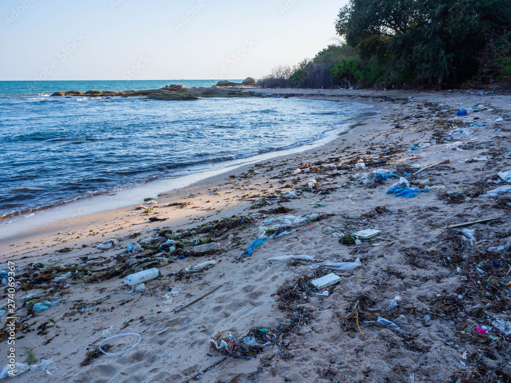Garbage on the beach. Spilled garbage on the beach of the big city ...