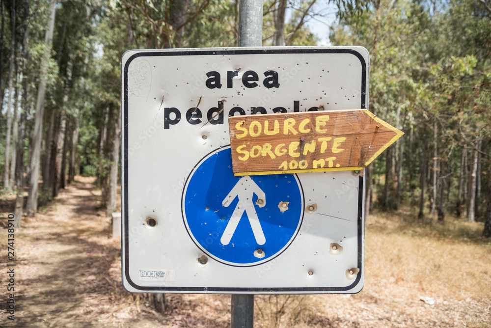 Pedestrian zone, the area pedonale sign, full of bullet holes - typical ...