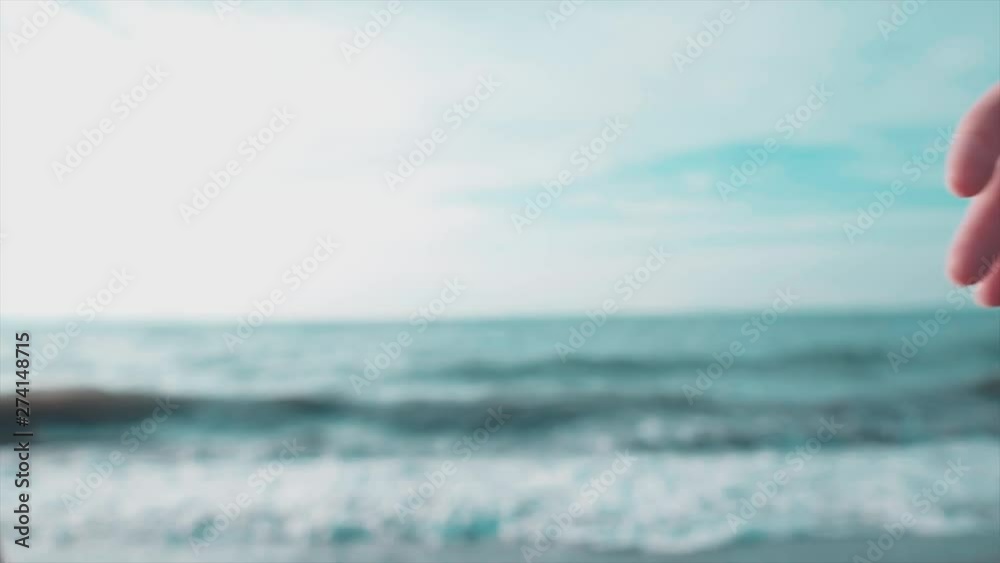 Deal hands, hand shake woman on sand, seaside. Blurry background with ...