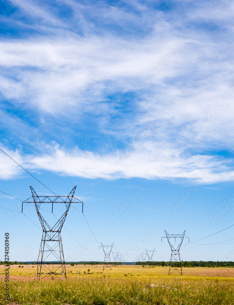 Electrical transmission towers and power lines on fields. Stock Photo ...
