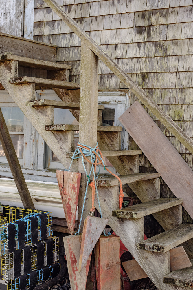 Weathered and rotted wooden steps lead up a clapboard shack on a remote ...