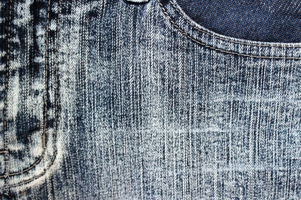 Background texture of blue faded denim jeans with pocket and fly stitch ...